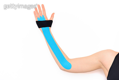 Close up studio shot of a female arm with tape, isolated over white ...
