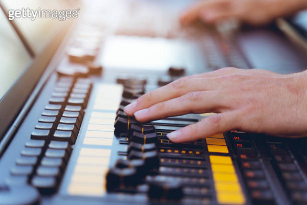 Sound technician or lights technicians control the music show in ...