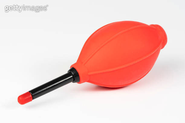 Red and black camera air blower for clearing dust particles from lens ...