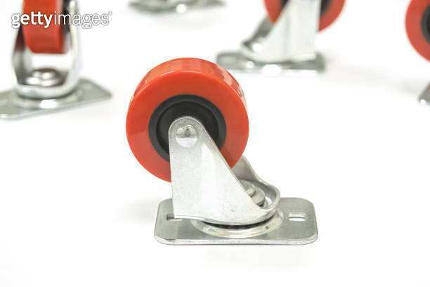 New red rubber caster wheel isolated on white background, industrial ...