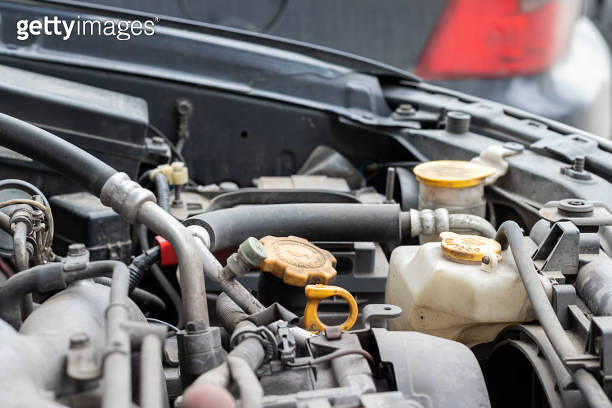 Oil probe, oil cap and antifreeze tank. Dusty details of a flat-four ...