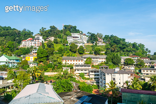 Beautiful builings on the green hills in the downtown, nex to the Kandy ...