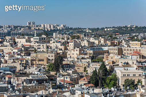 Aerial view of rooftops of buildings in the old city with blue sky of ...