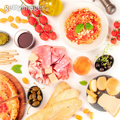 Italian food square overhead shot. Pizza, pasta, cheese, ham, capers ...