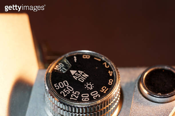 Setting wheel for ISO and aperture on an old camera photographed in the ...