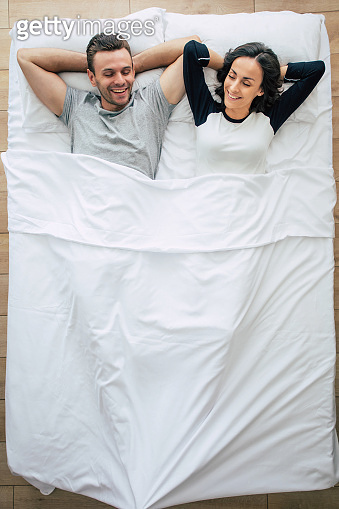 Bedtime. The family are sleeping. Beautiful young couple in love are ...