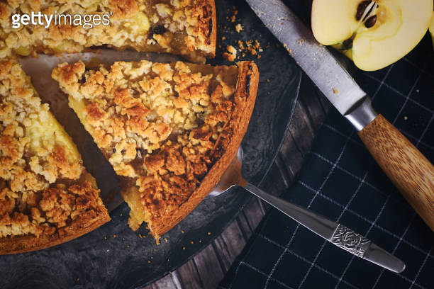 Slice of traditional European apple pie with topping crumbles on cake ...