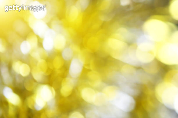 Festive background of yellow illuminating color, shine and glittering ...