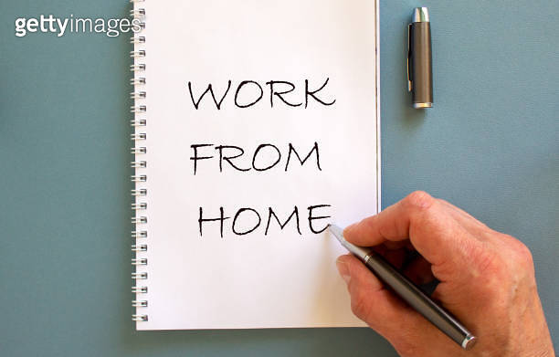Hand writing 'work from home', isolated on blue background. 이미지 ...