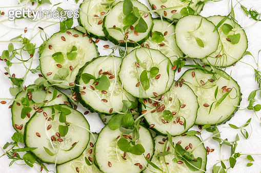 Young sprout microgreens with sliced cucumber and flaxseeds 이미지 ...