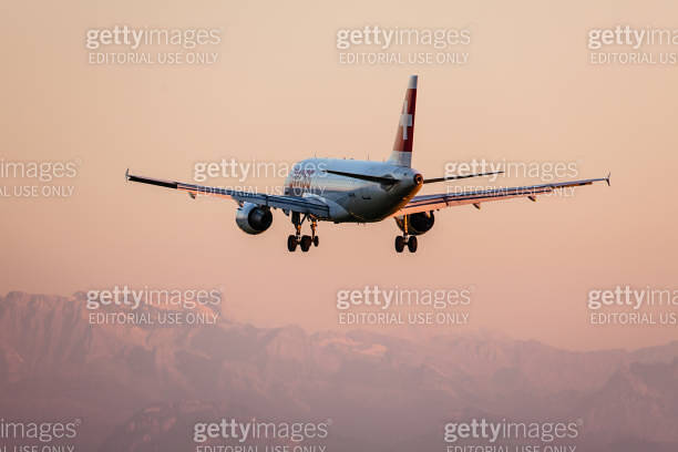 Swiss International Air Lines Airbus A318 landing in front of the Swiss ...