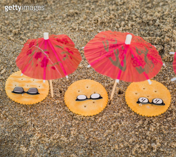 Crackers at the beach cathching some sun under an umbrella. Funny ...