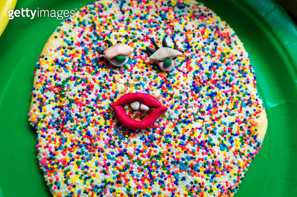 Giant sprinkle cookie with a funny face, anthropomorphic food ...
