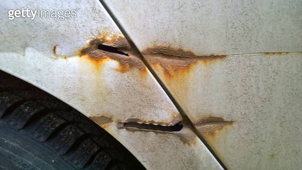 Dirty white color car with rust, corrosion, defects and scratches ...