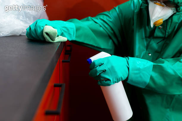 Person eliminating bacteria by spraying disinfectant liquid stock photo ...