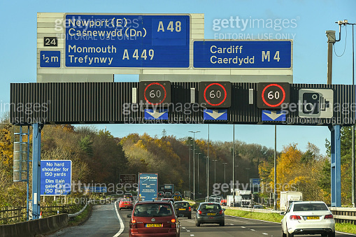 Traffic on the M4 Motorway at Newport passing signs for the variable ...