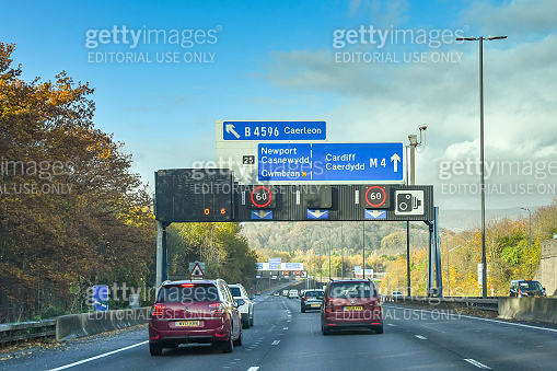 Traffic on the M4 Motorway at Newport passing signs for the variable ...