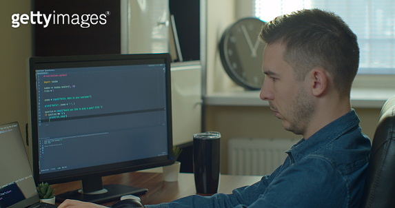 Man coding html and programming on screen Monitors, development web ...