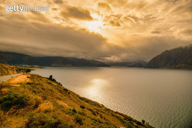 Cloudy moody overcast morning at lake Hawea, it felt very weird and ...