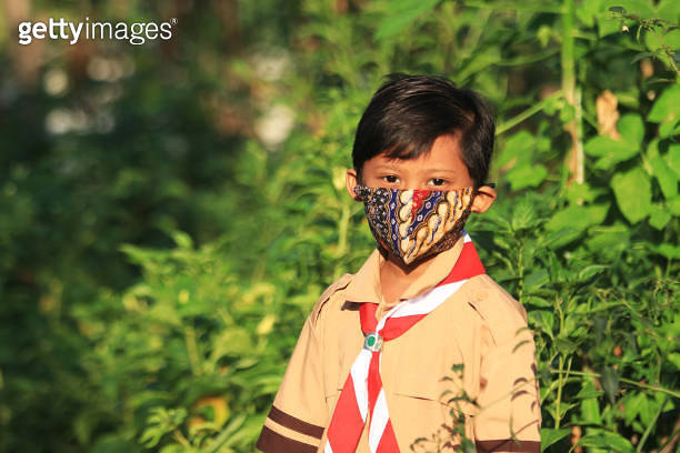 A boy scout wearing a mask during Covid-19 pandemic 이미지 (1278906510 ...