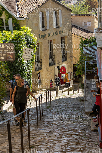 Tourists in the cobbled streets of Saint Emilion. France. (1212181300 ...