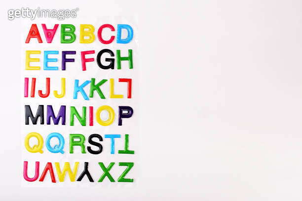Multi colored alphabet letters sticker label on the white background ...