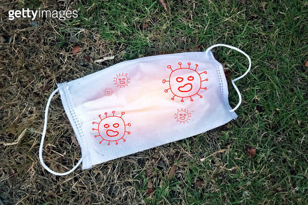 garbage mask drop on ground floor with corona virus covid-19 graphic ...