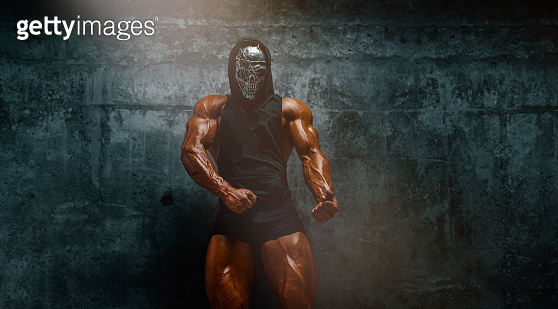 Mysterious Muscular man hiding behind mask Flexing Muscles. Bodybuilder ...