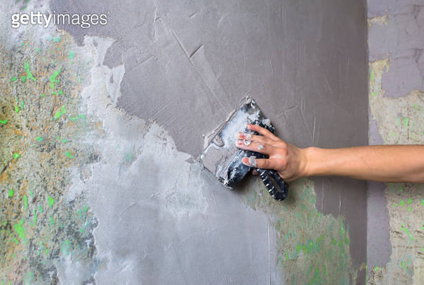 Repair the wall. Plaster the wall with a spatula. Internal construction ...