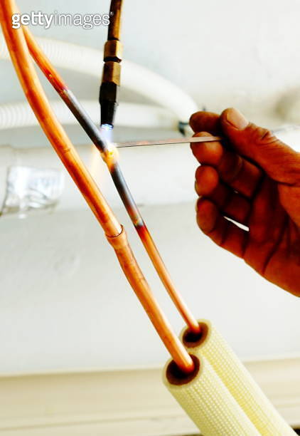Technician are soldering a coil at Sweating a Copper Joint (1219561277 ...