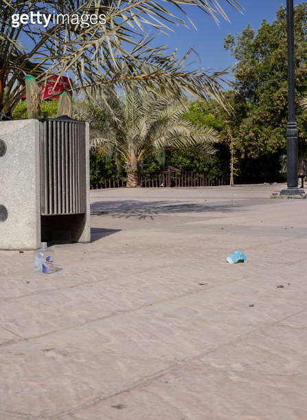 people thrown face mask on park in abu dhabi - united arab emirates ...