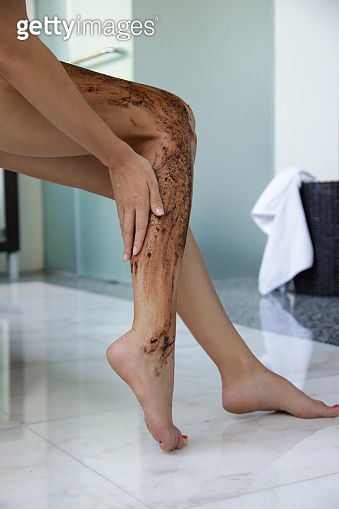 DIY Coffee scrub. Beauty skin care. Young woman putting coffee scrub on ...