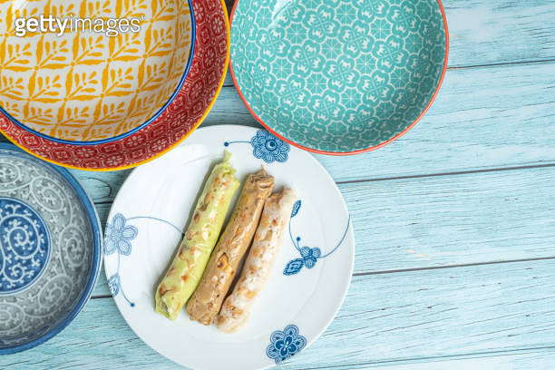 Thai coconut Flavors Candy Wrap With Colorful Paper on Old Ceramic Dish ...