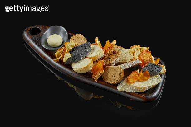 Different types of bread - white, rye and ink cuttlefish on a wooden ...