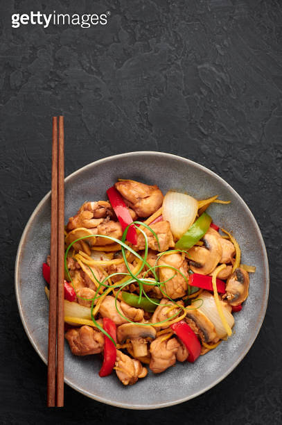 Thai Ginger Chicken or Gai Pad King in gray bowl at black slate ...