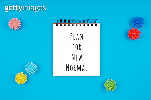 White notepad with plastic balls as viruses on the blue. Coronavirus ...