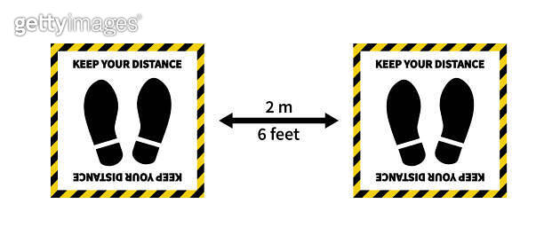 Social distancing. Footprint sign. Keep the 2 meter distance ...