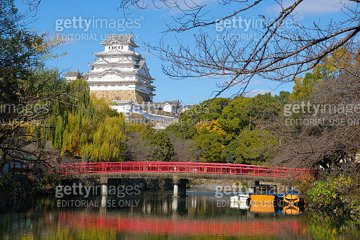 The Himeji castle with red bridge at front, an UNESCO World Heritage ...