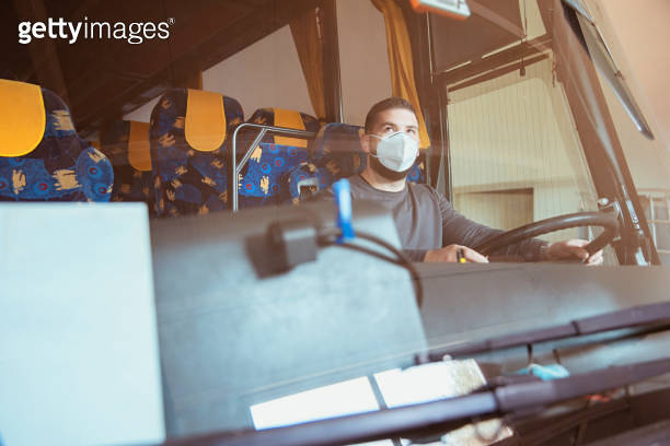Professional bus driver in white protective suit wearing mask 이미지 ...