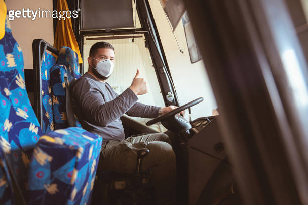 Professional bus driver in white protective suit wearing mask 이미지 ...