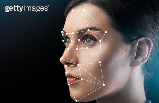 Beautiful woman with scanning grid on her face against black background ...
