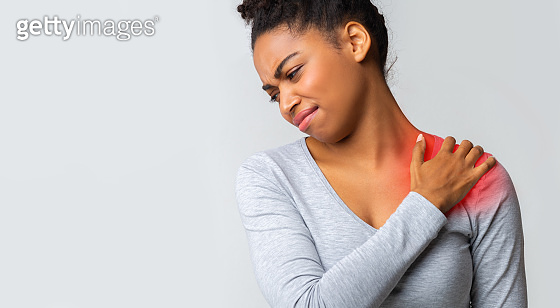 Sad girl having strong pain in shoulder, massaging painful zone 이미지 ...
