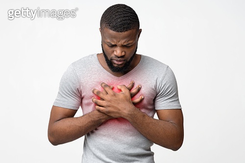 Sad young man suffering from acute pain in chest 이미지 (1199688091) - 게티이미지뱅크