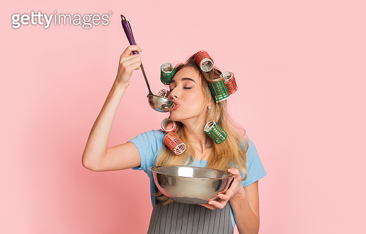 Cooking delicious dinner. Funny housewife tasting food 이미지 (1217805515 ...