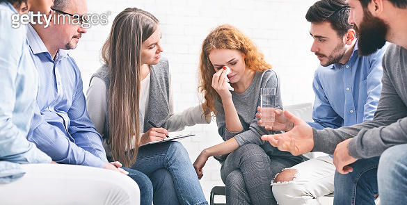 Depressed crying woman receiving empathy from Support Group members 이미지 ...