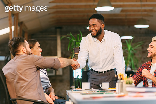 CEO handshaking with employee, congratulating with professional ...
