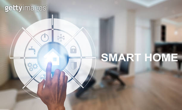 Closeup of young guy using smart home automation control system ...