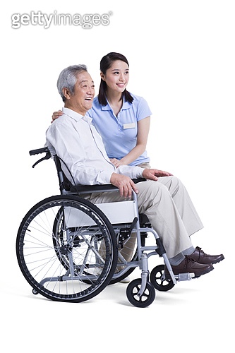 Female nursing assistant taking care of senior in wheelchair 이미지 ...