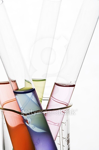 Four test tubes with colored liquid in beaker, close-up 이미지 (a10904969 ...