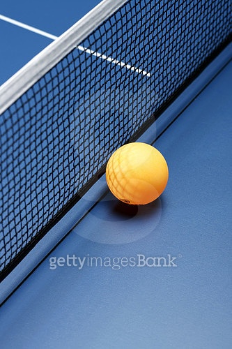 Yellow ball near table tennis net on table tennis table, close-up 이미지 ...